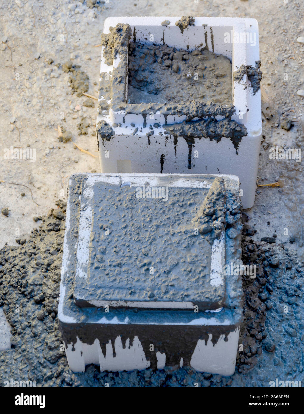 polystyrene mold for concrete test. Focus is on the tools and tiles ...