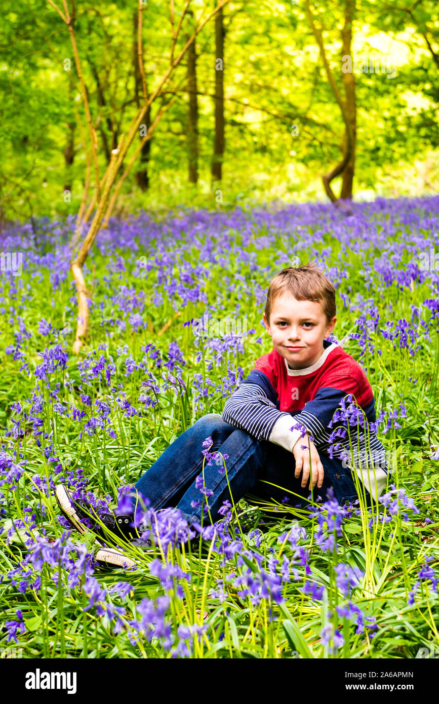 A handsome little boy with ADHD, Autism, Aspergers Syndrome sits and ...