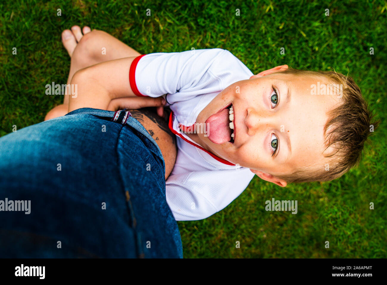 A handsome little boy with ADHD, Autism, Aspergers Syndrome hangs on to ...