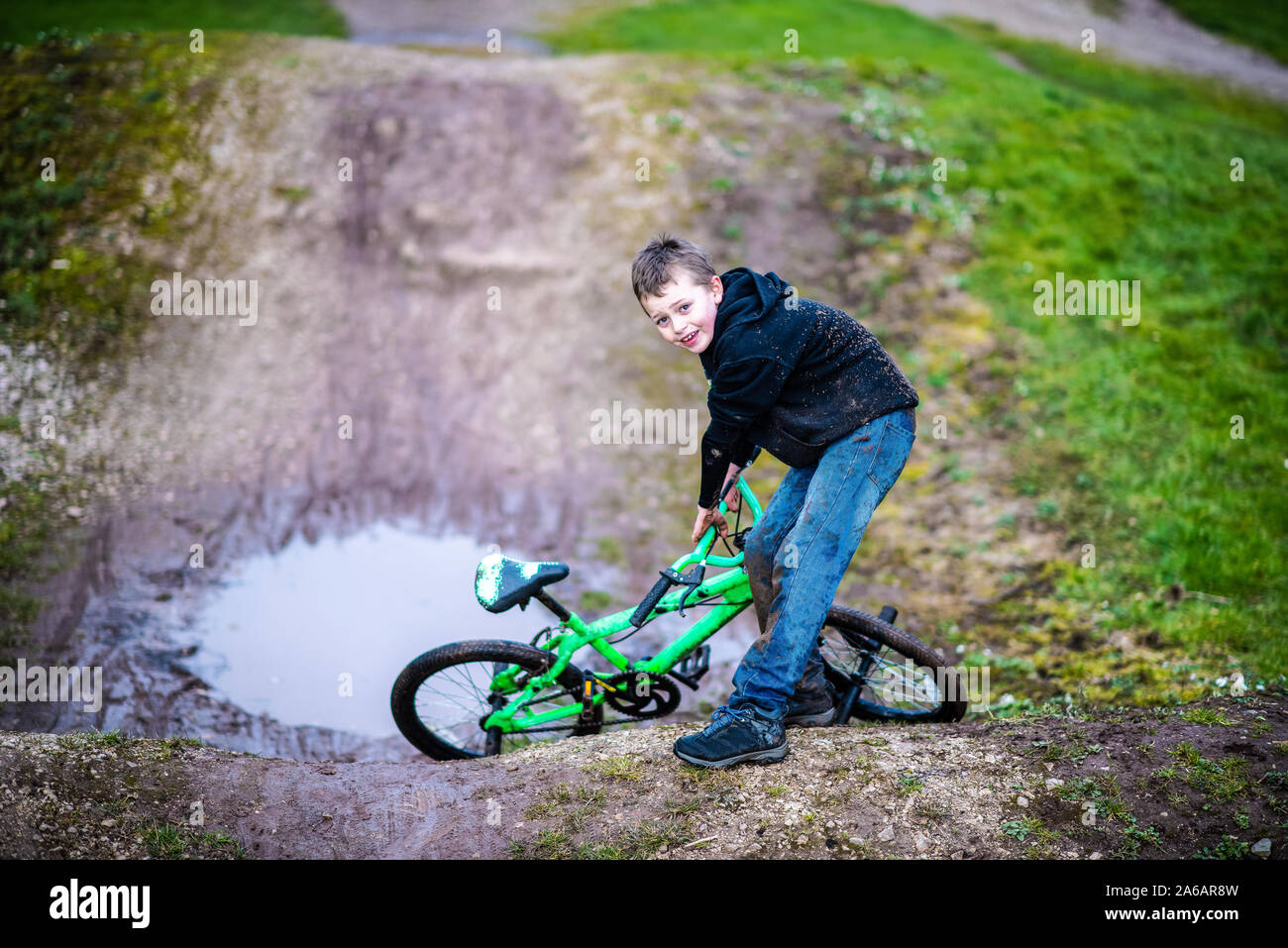 Child falling off bike hi-res stock photography and images - Alamy