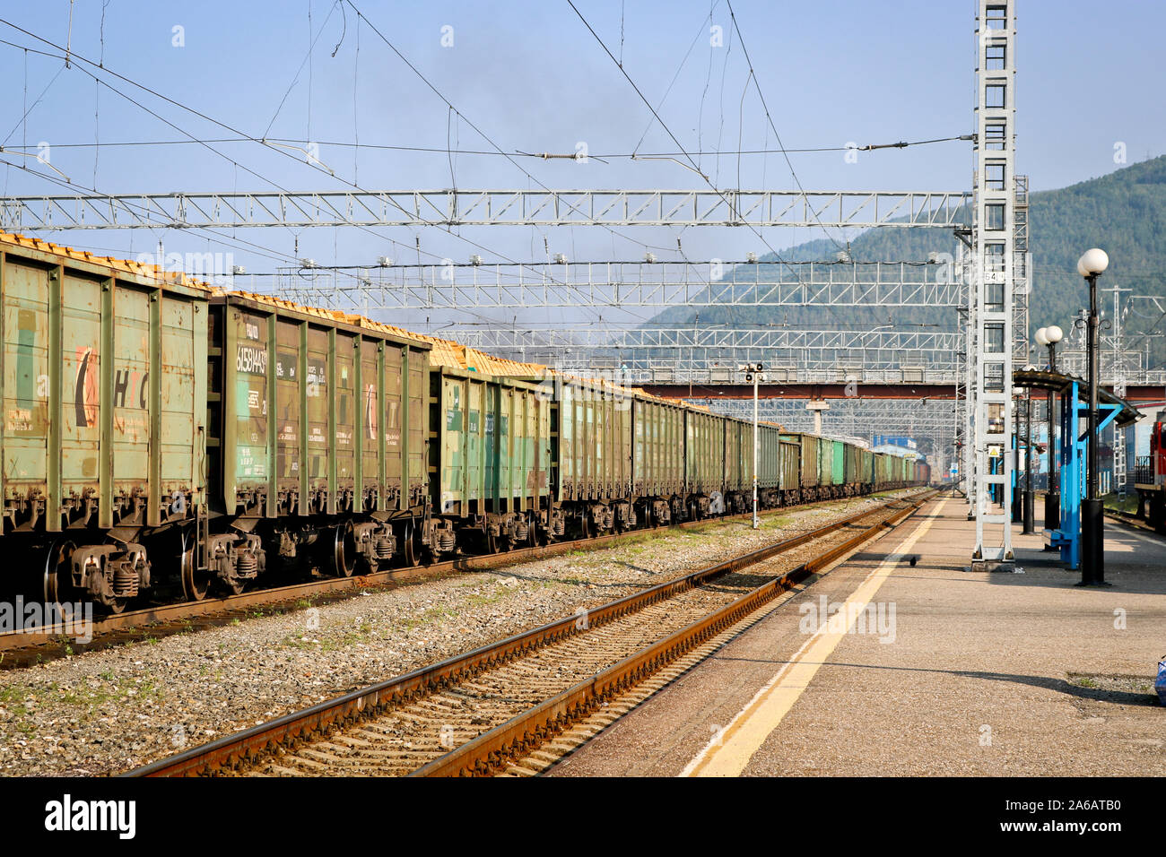 Freight train passing on industrial hi-res stock photography and images ...