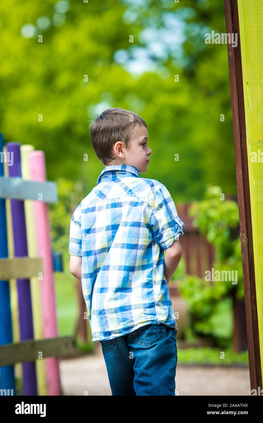 A little boy with ADHD, Autism, Aspergers syndrome enjoys playing with ...