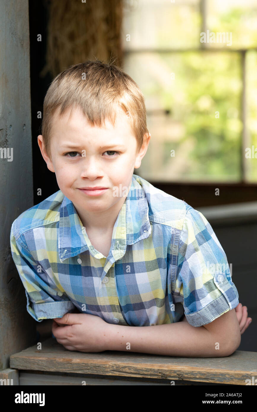 A little boy with ADHD, Autism, Aspergers syndrome enjoys playing with ...