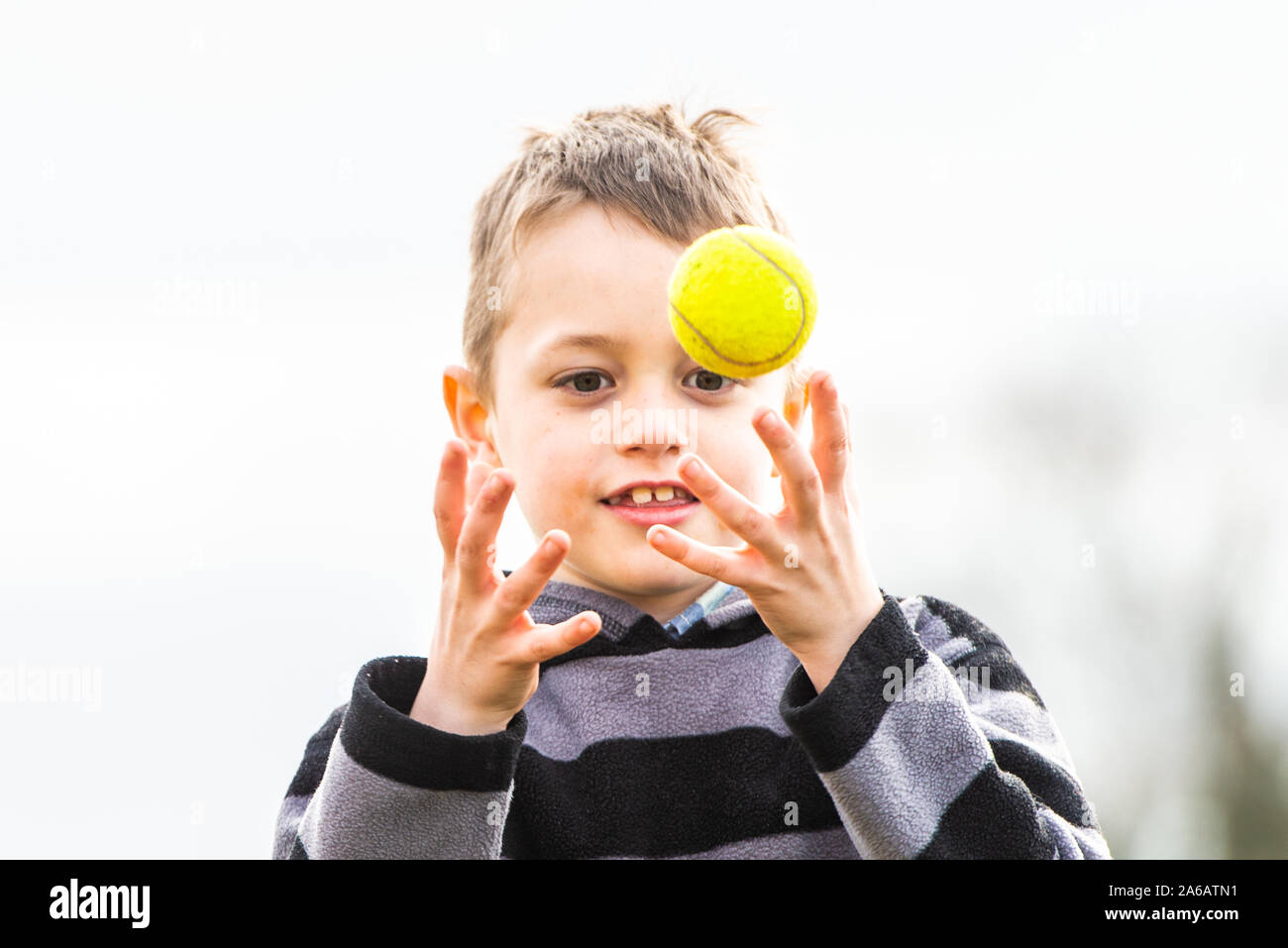 A handsome little boy with ADHD, Autism, Aspergers Syndrome practices ...