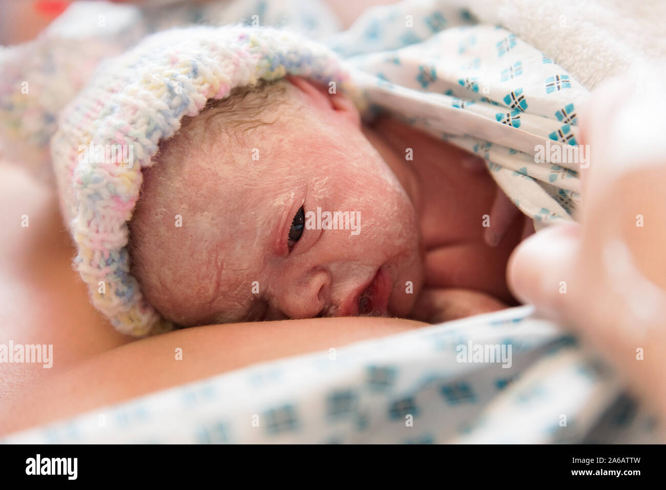 A young baby girl is born premature weighing just 4lbs, pictured here ...