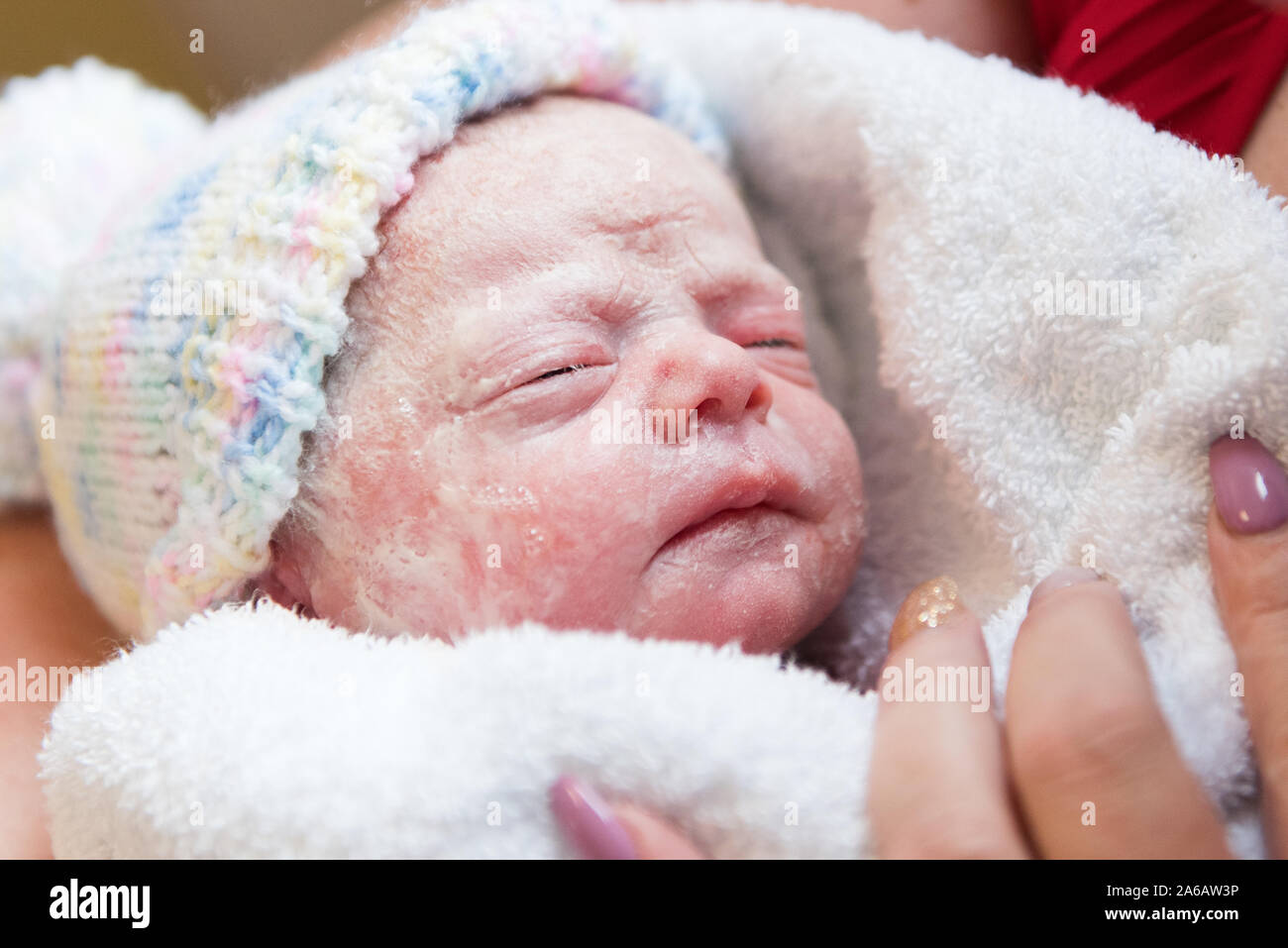 A young baby girl is born premature weighing just 4lbs, pictured here ...