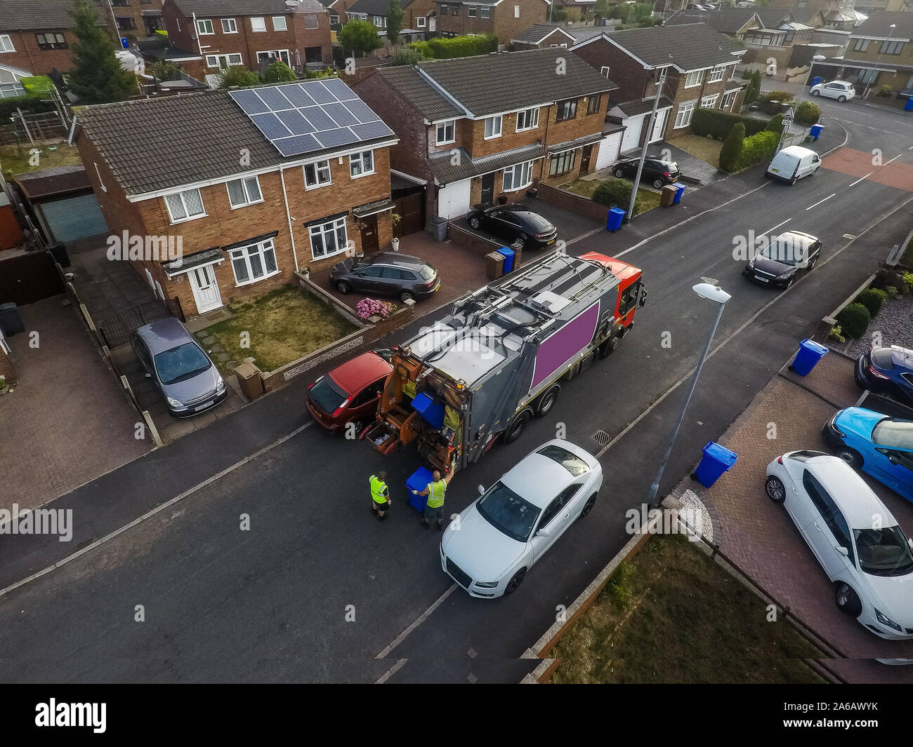 Aerial View of Dustmen putting recycling waste into a waste truck, Bin ...
