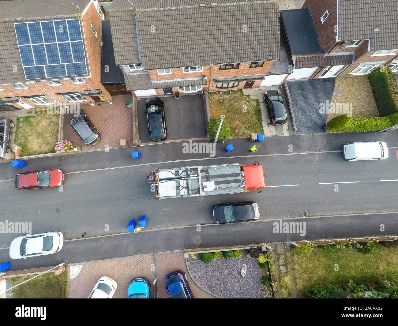 Aerial View of Dustmen putting recycling waste into a waste truck, Bin ...