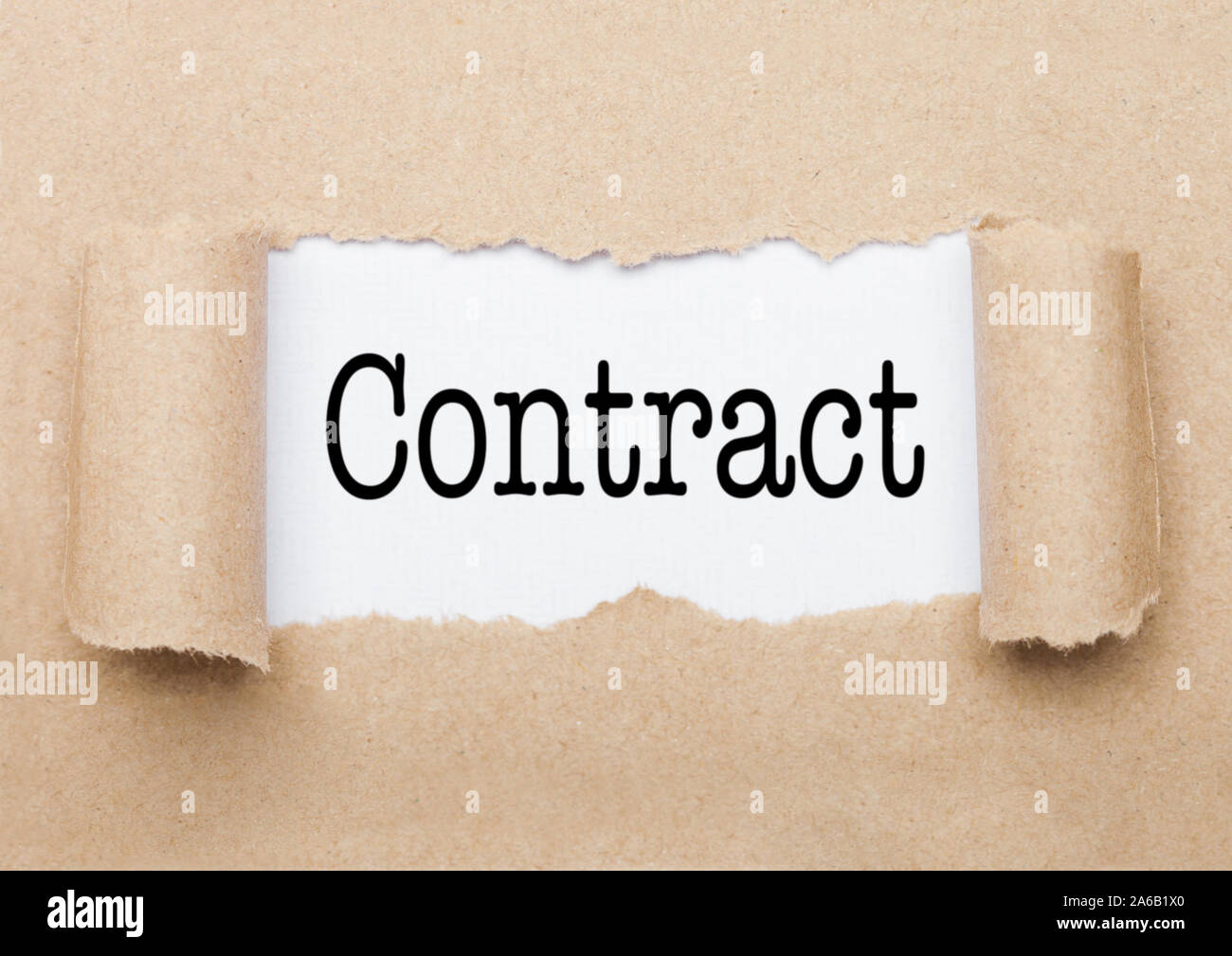 Contract concept text appearing behind torn brown paper envelope Stock ...