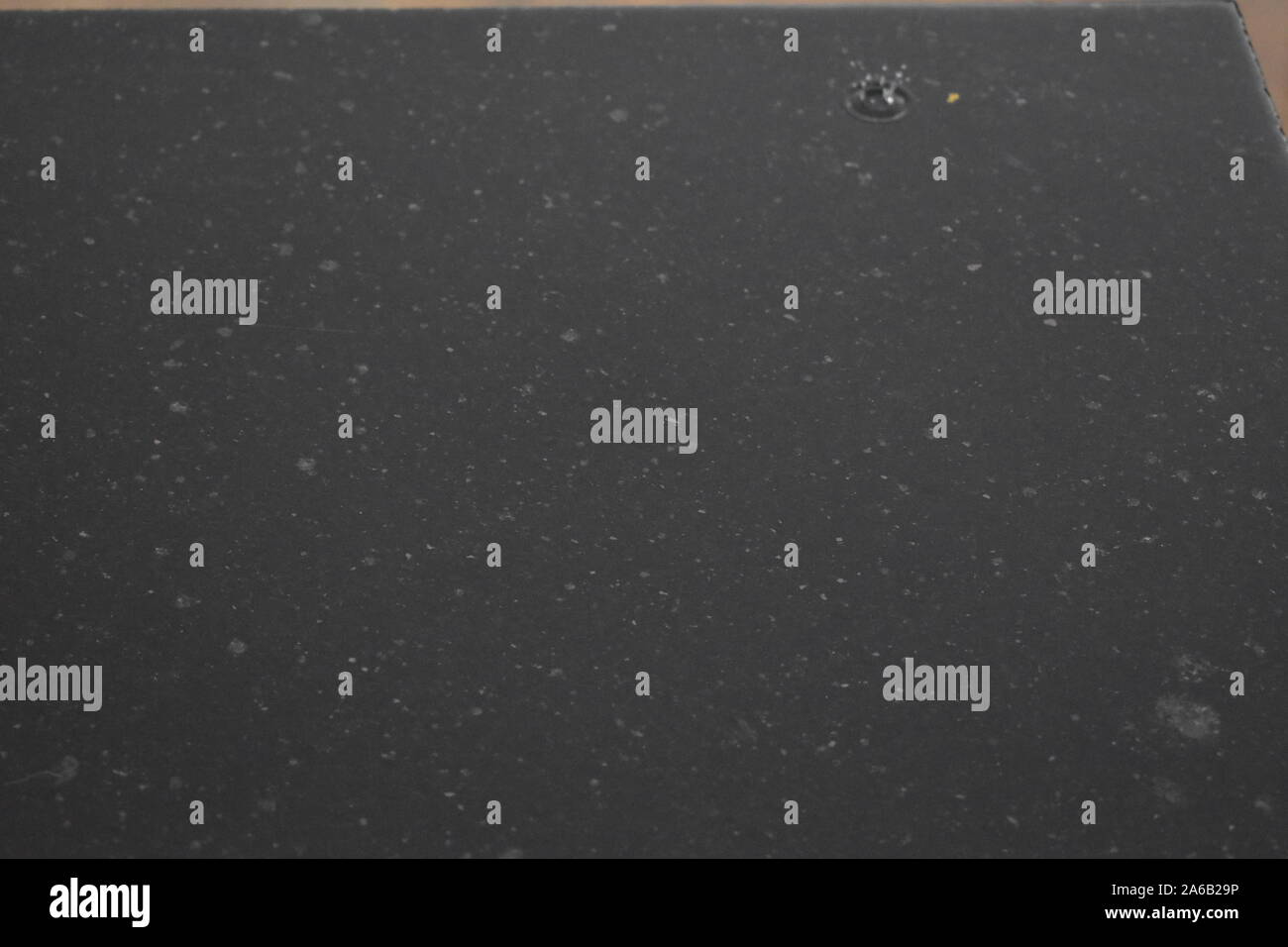 rain drops on the surface of water in a granite stone with graduated ...