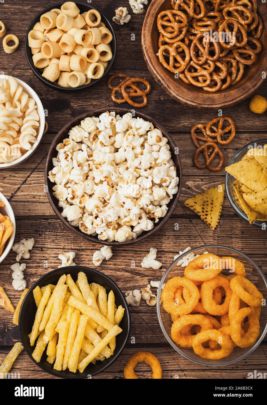 All classic potato snacks with peanuts, popcorn and onion rings and ...