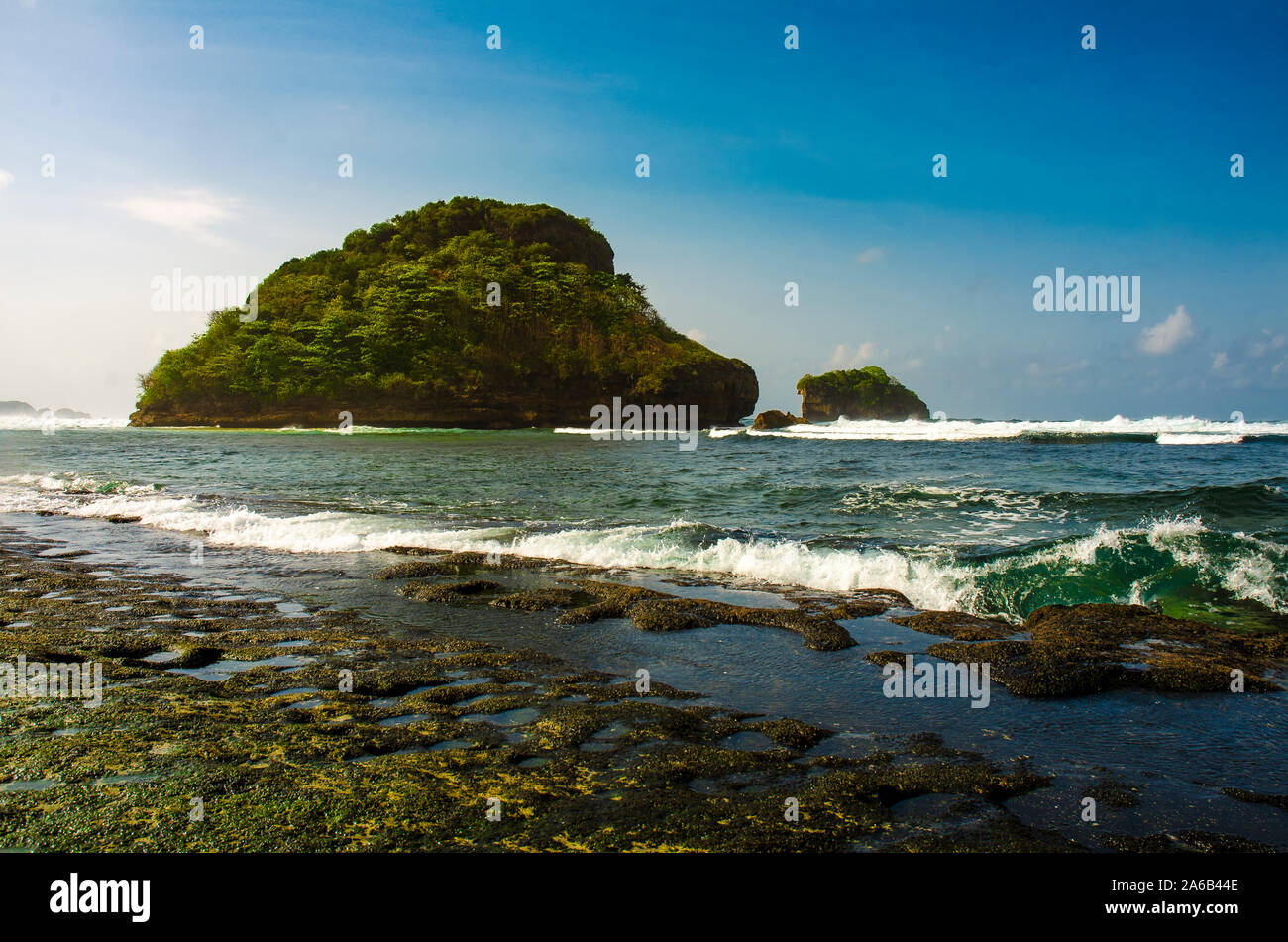 tropical island in the sea, Goa Cina Beach, Malang, East Java ...