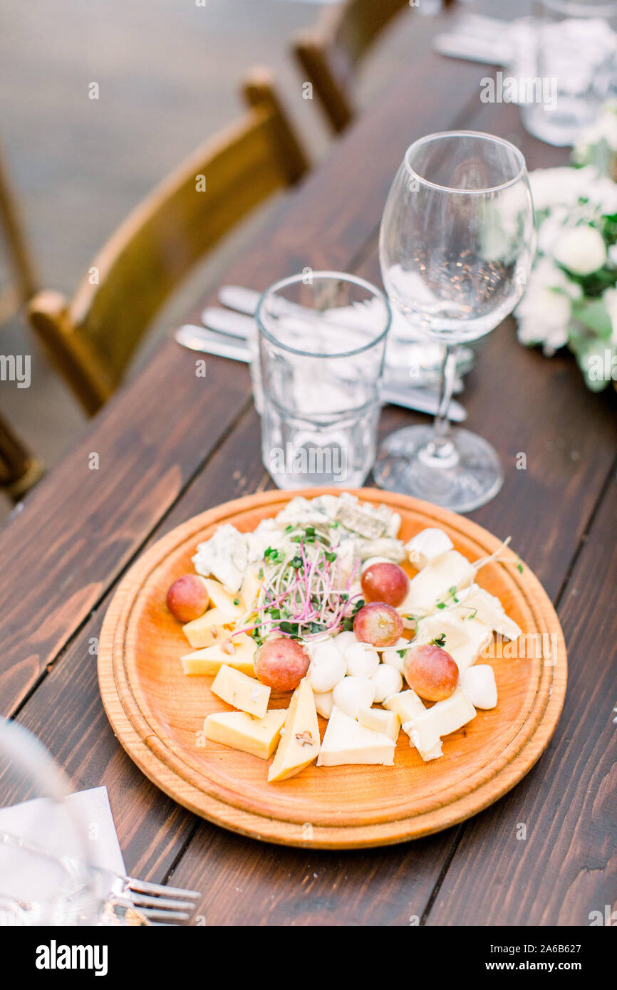 Catering service. Wooden restaurant table with food at event Stock ...