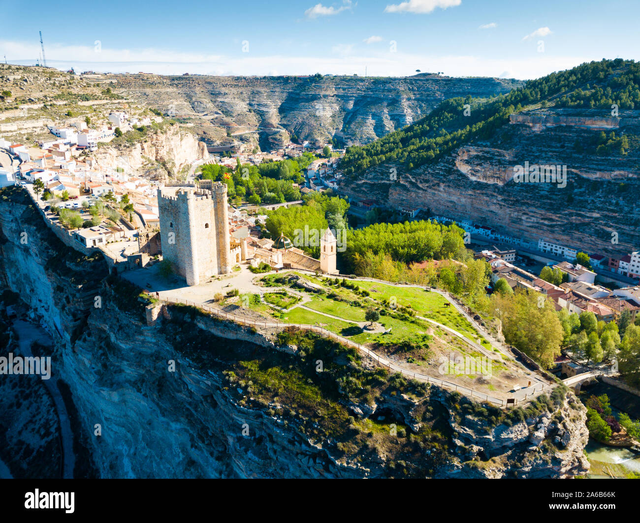 Picturesque landscape with small Spanish town of Alcala del Jucar atop ...