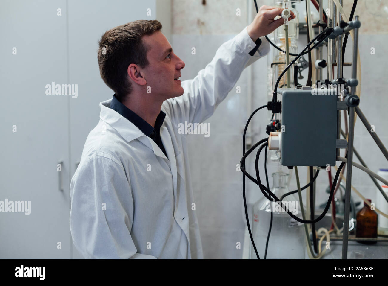scientist in the medical laboratory conducts chemical experiments with ...
