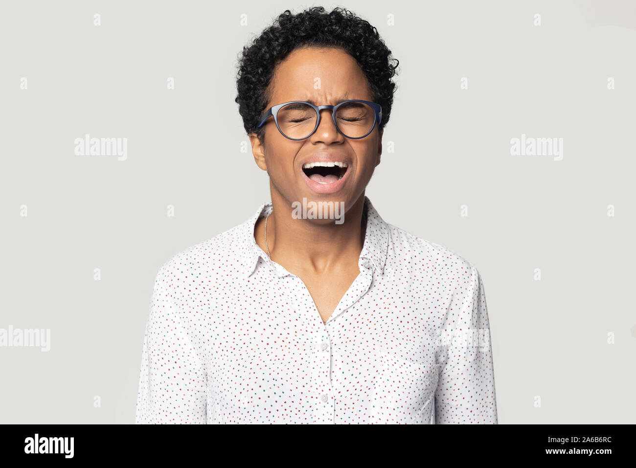 Head shot angry stressed African American woman screaming Stock Photo ...