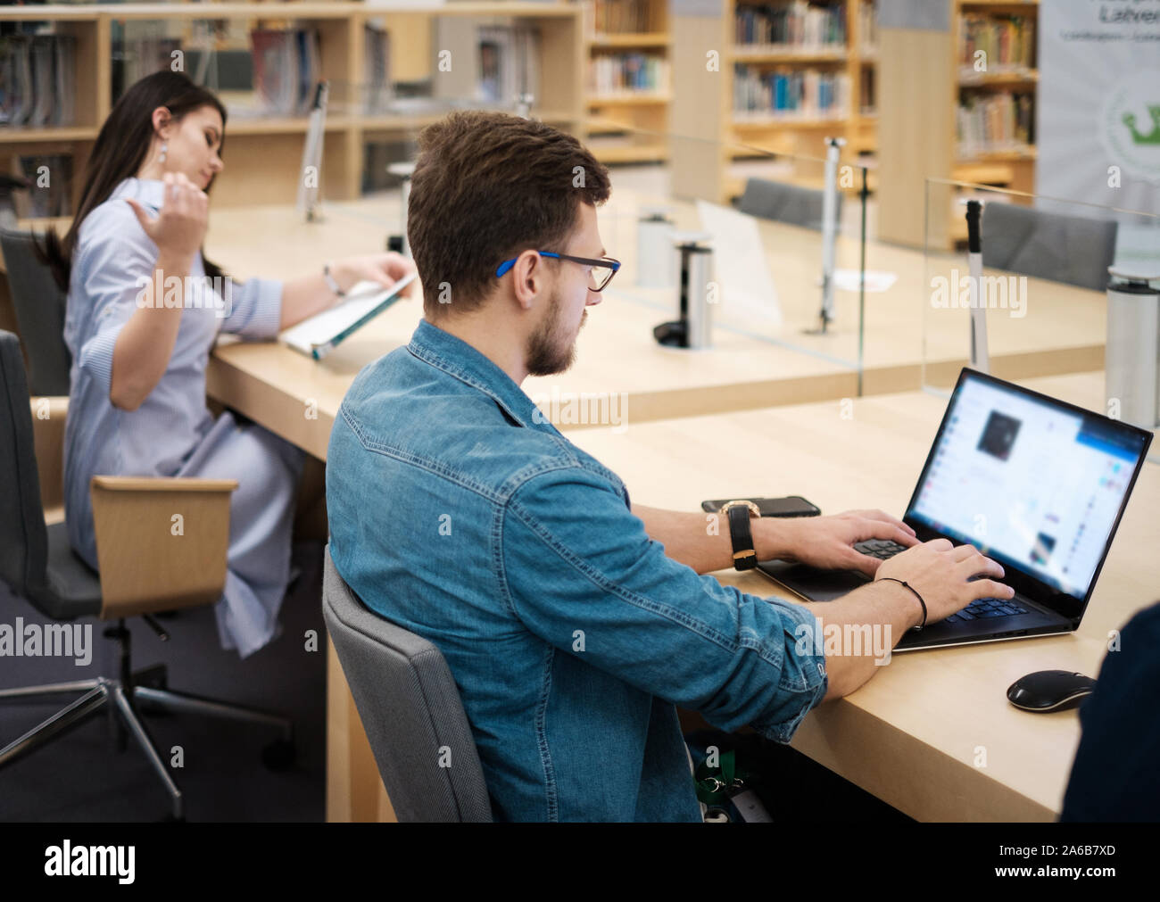 Students studying in a public library Stock Photo - Alamy