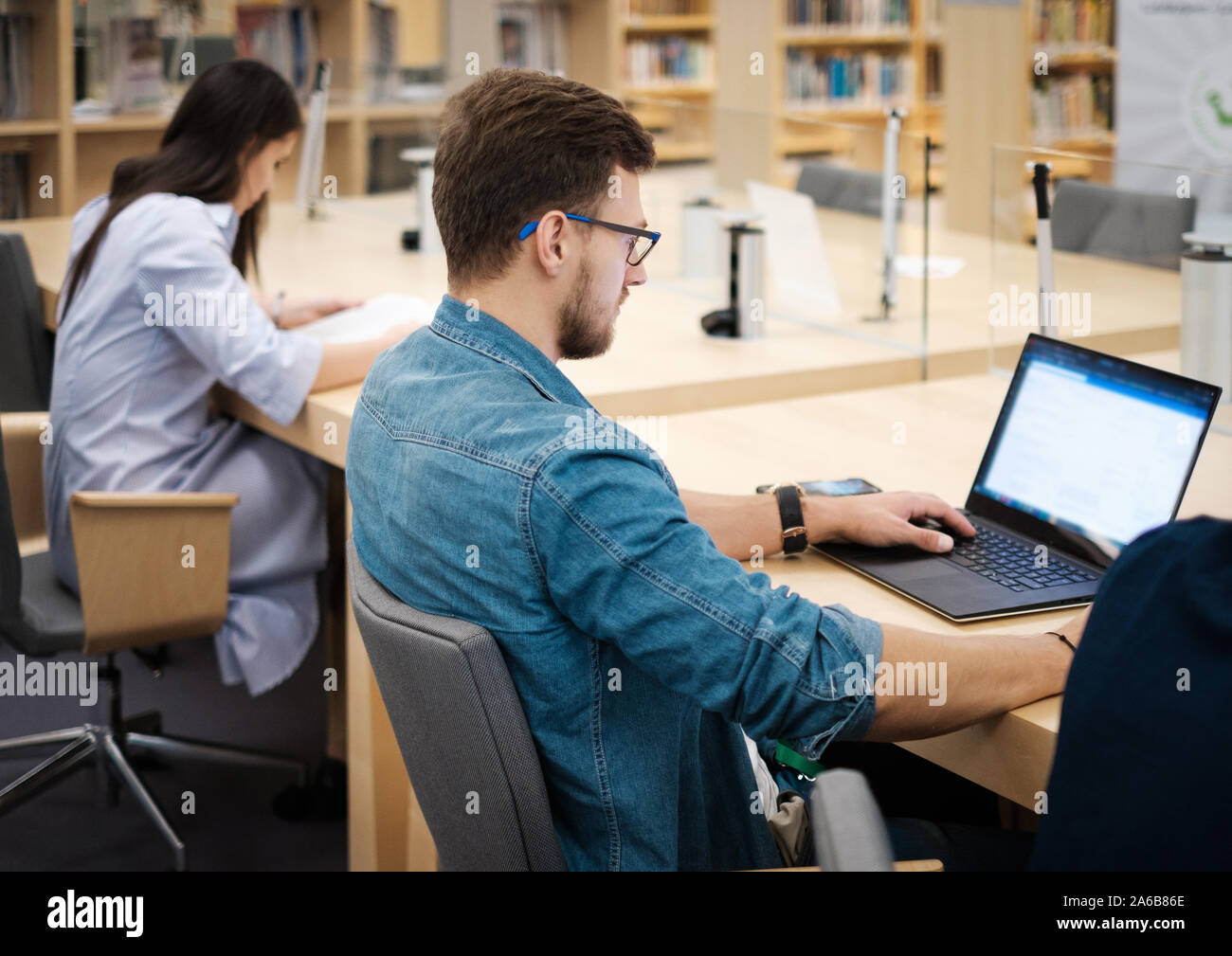 Students studying in a public library Stock Photo - Alamy