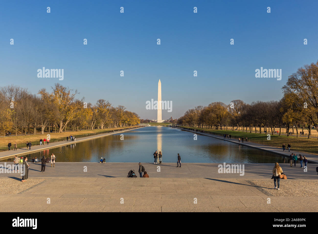 Sunset view of the Washington Monument with golden sunlight and the ...