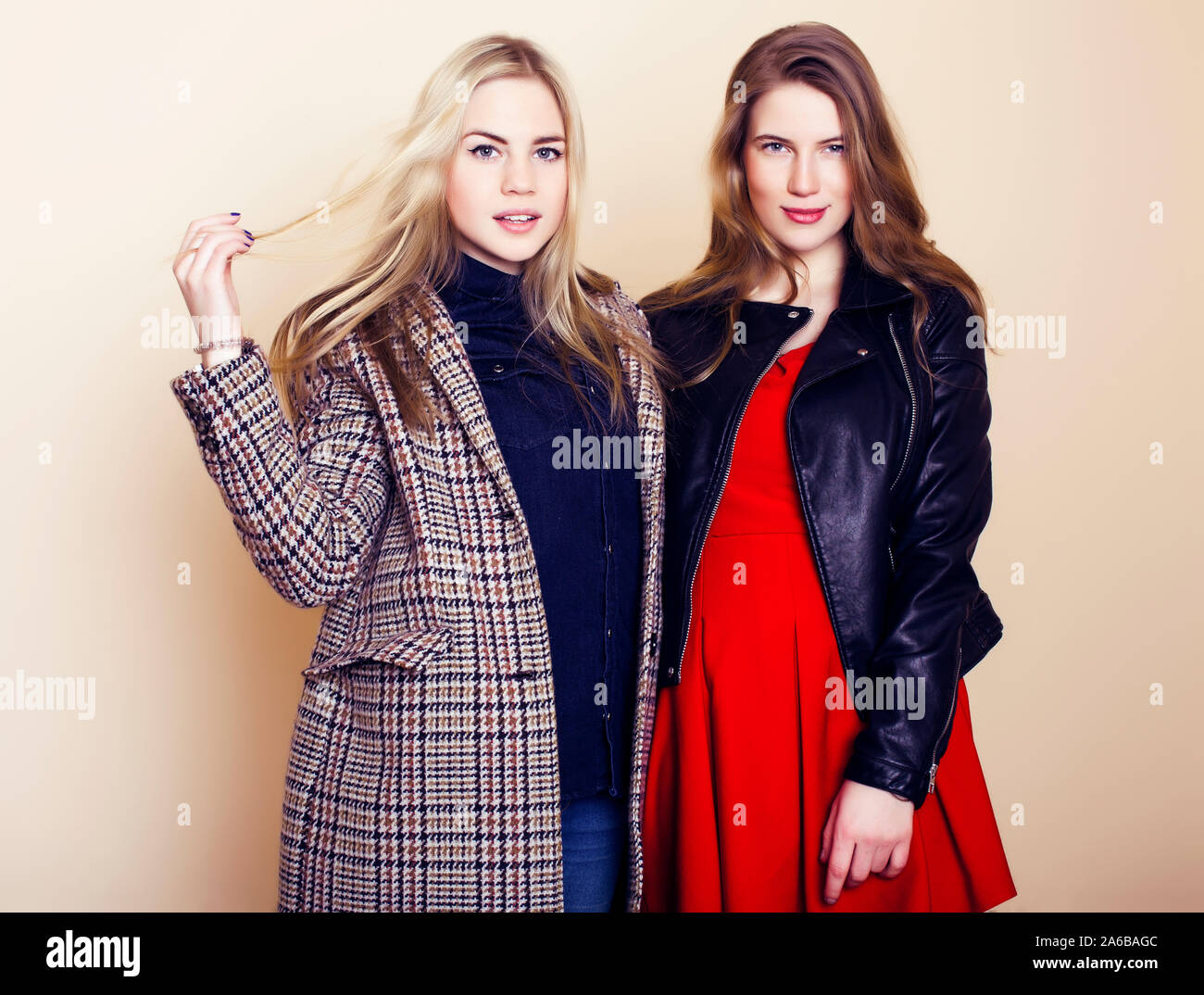 lifestyle and people concept: Fashion portrait of two stylish girls ...