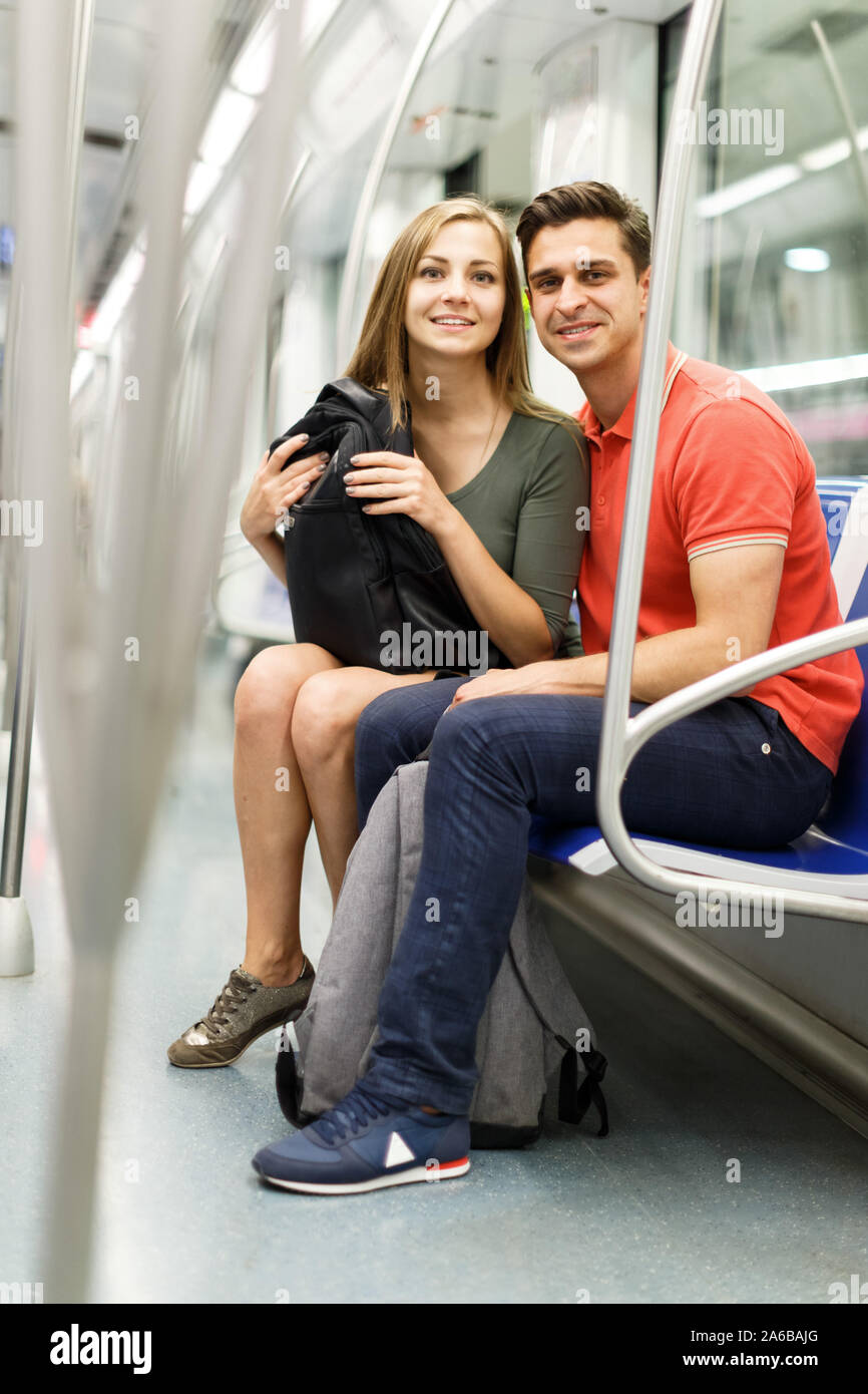 Couple is standing in the train in the underground Stock Photo - Alamy