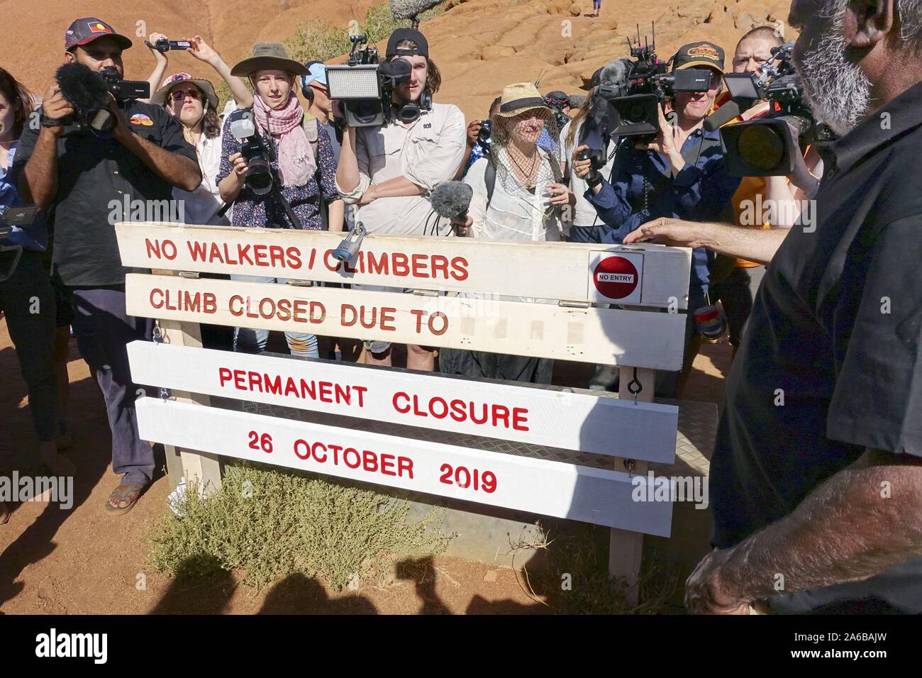 Uluru, Australia. 25th Oct, 2019. A sign announcing the controversial ...