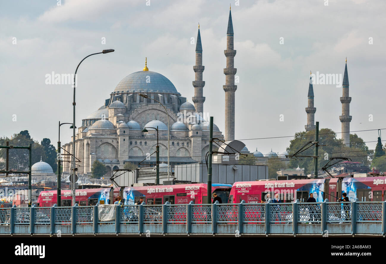 ISTANBUL TURKEY RED TRAM AND FISHERMEN ON THE GALATA BRIDGE WITH THE ...