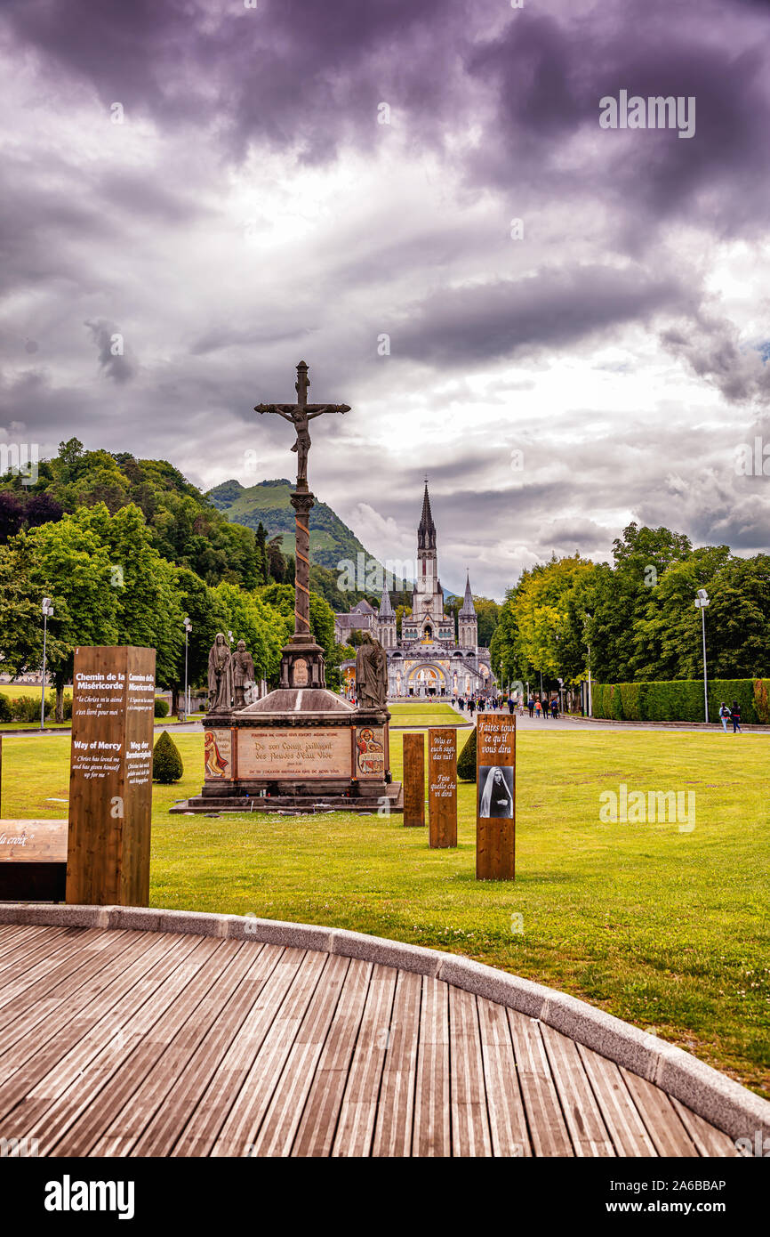 LOURDES - JUNE - 15 - 2019: Christian cross on a background the ...