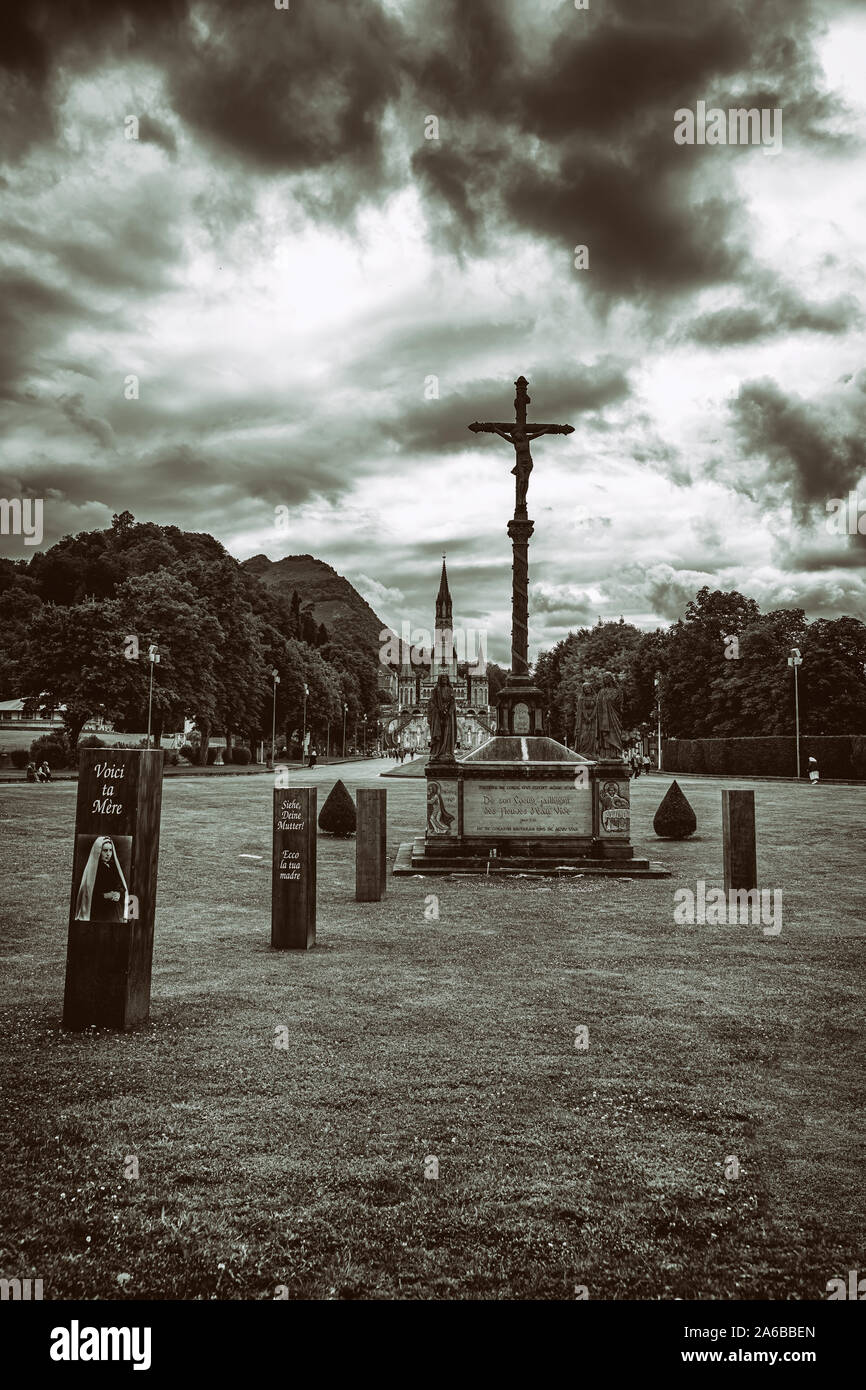 LOURDES - JUNE - 15 - 2019: Christian cross on a background the ...