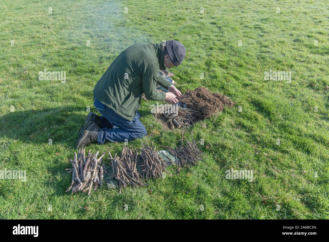 Lighting a fire pit hi-res stock photography and images - Alamy