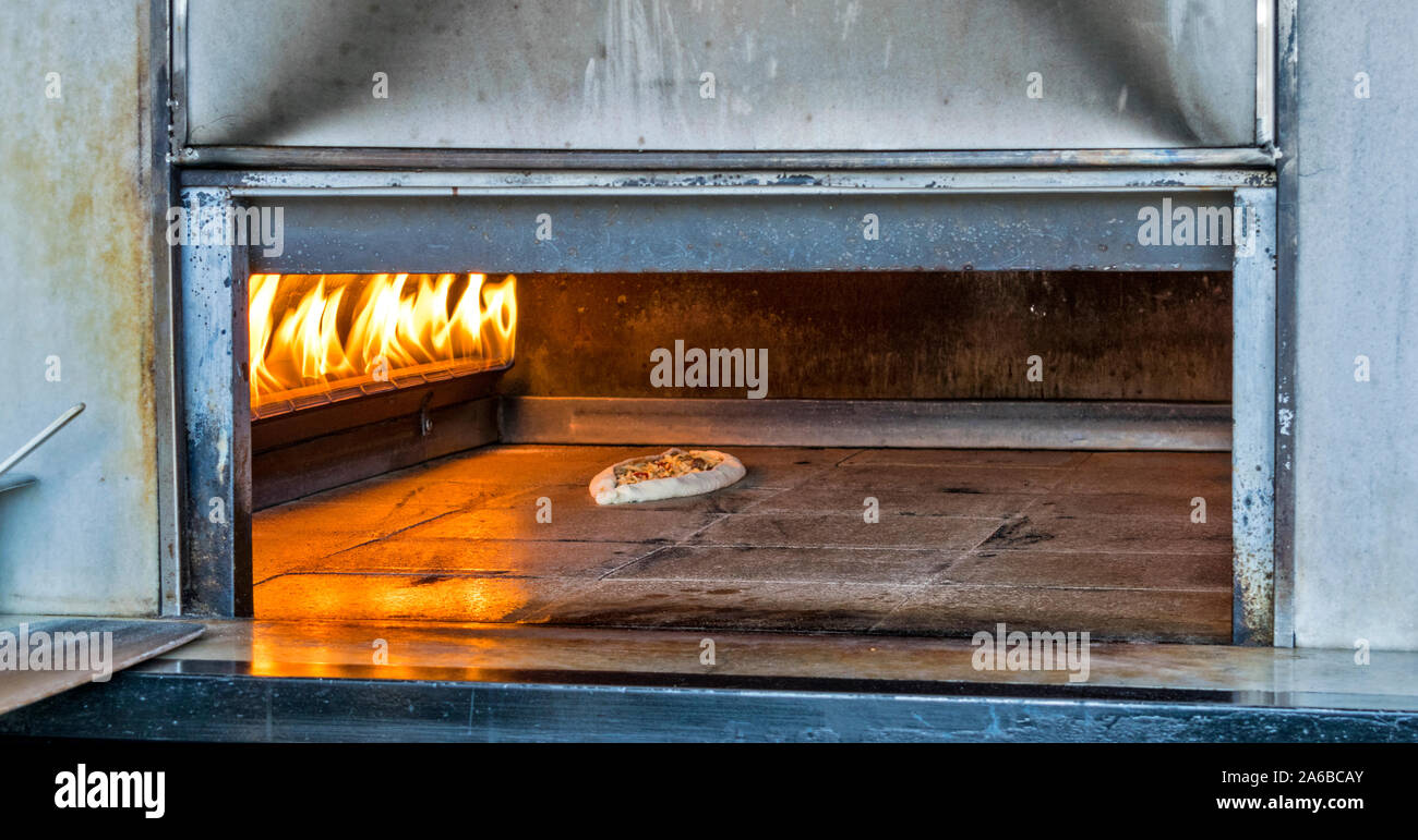 ISTANBUL TURKEY THE PASTRY COOKING IN THE OVEN BELOW THE FLAMES Stock ...