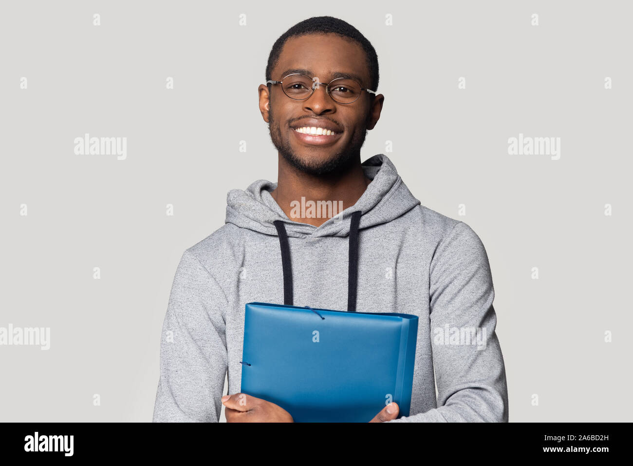 Head shot portrait smiling African American man holding folder Stock ...