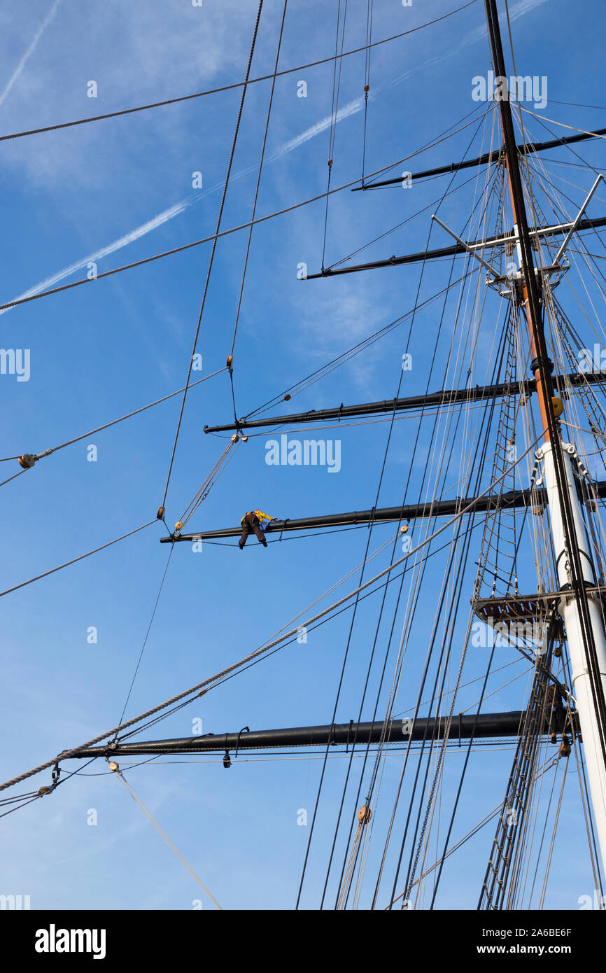 Person working in the rope / ropes and rigging on the main deck of the ...
