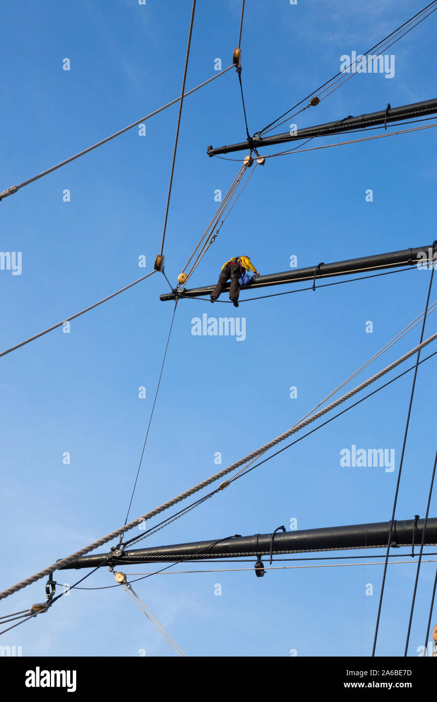 Person working in the rope / ropes and rigging on the main deck of the ...