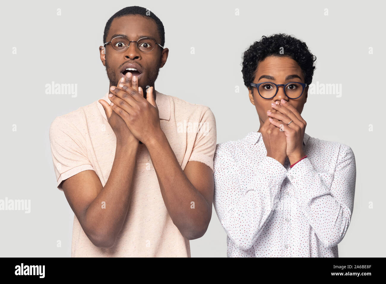 Head Shot Shocked African American Couple Covering Mouths With Hands