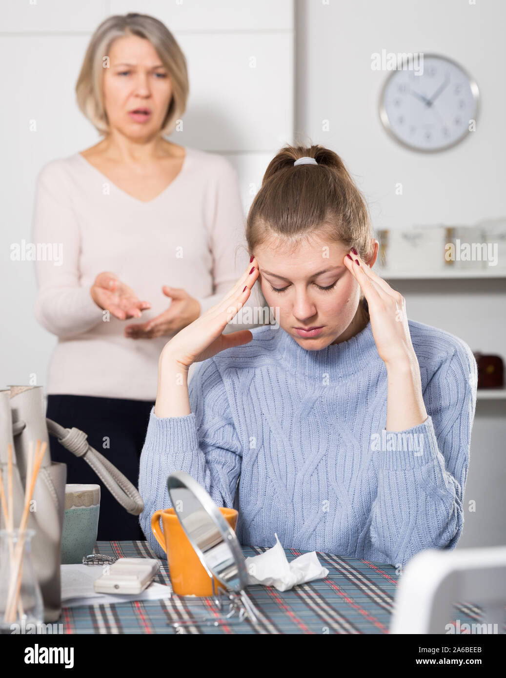 Senior mother lecturing her sad adult daughter at home Stock Photo - Alamy