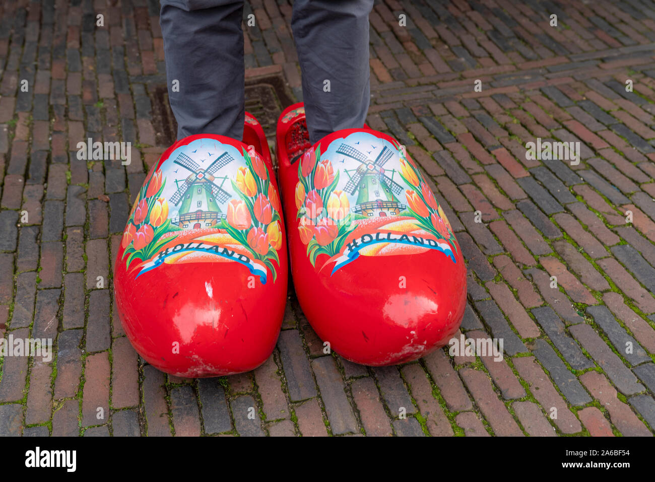 Big clogs with man's leg in Holland. Man try big clogs in Nederland ...