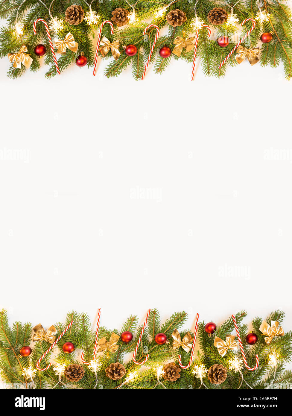 Christmas frame border of fresh spruce branches decorated with red ...