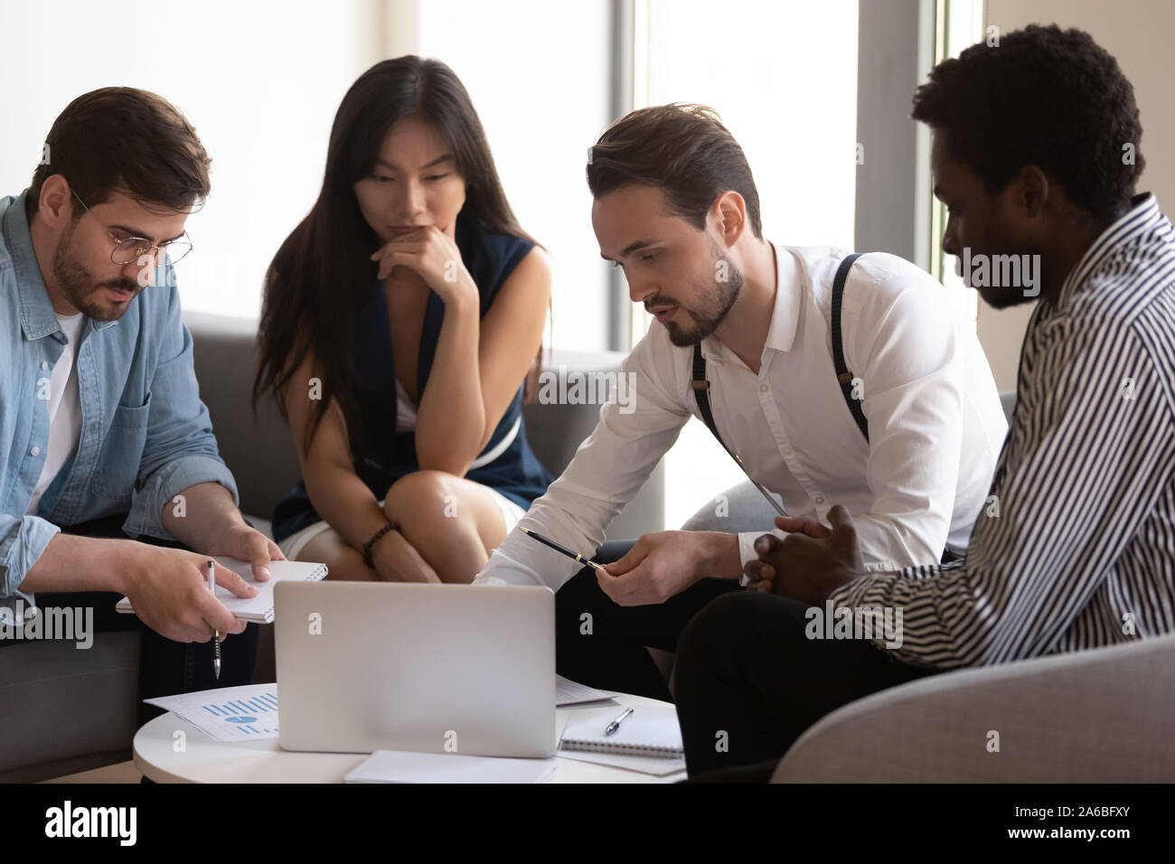 Diverse employees listening to mentor at briefing, staff training Stock ...