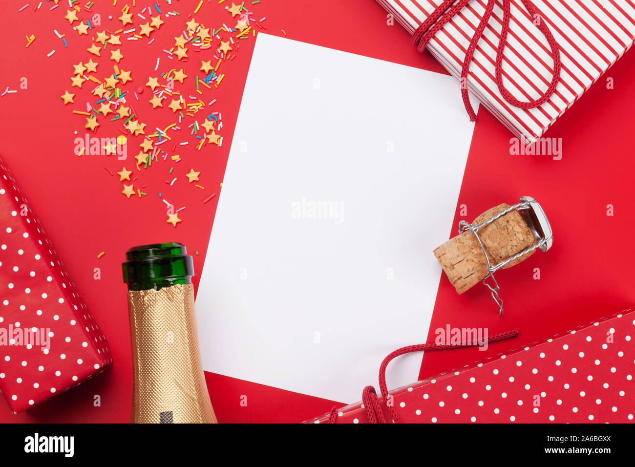 Champagne bottle, blank card, gift boxes and sweets holiday template ...