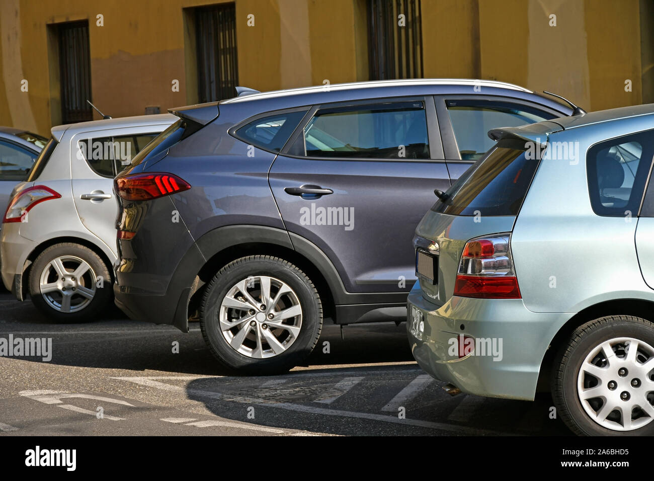Cars in the parking lot in a row Stock Photo - Alamy