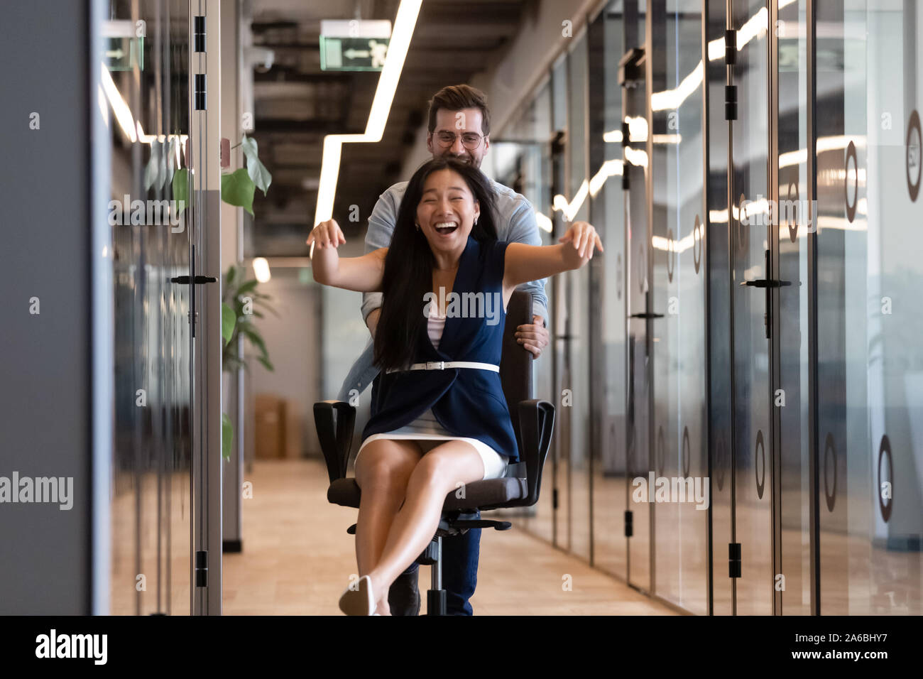Person pushing office chair hi-res stock photography and images - Alamy