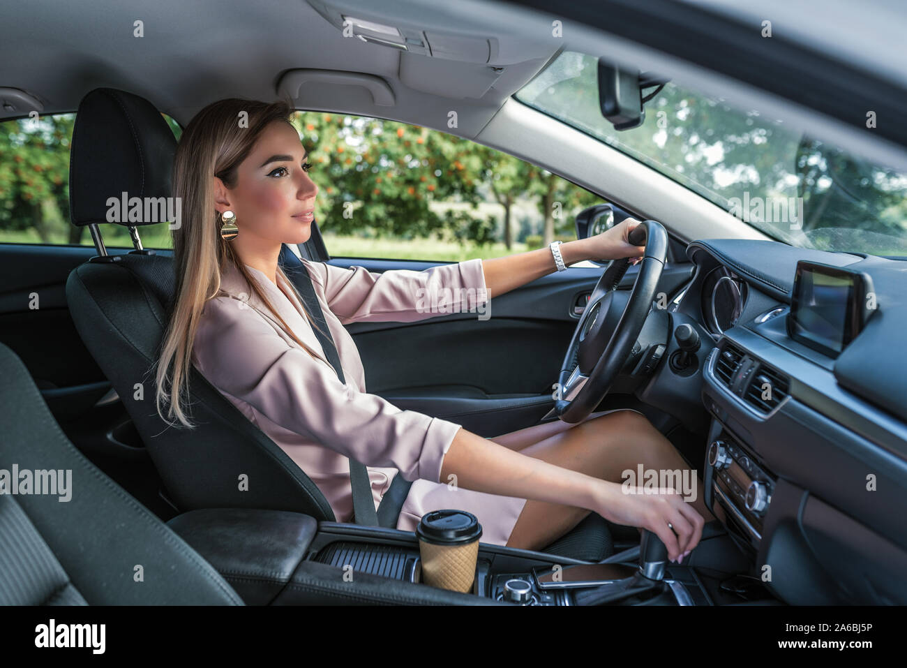 Woman driving reversing car looking hi-res stock photography and images ...