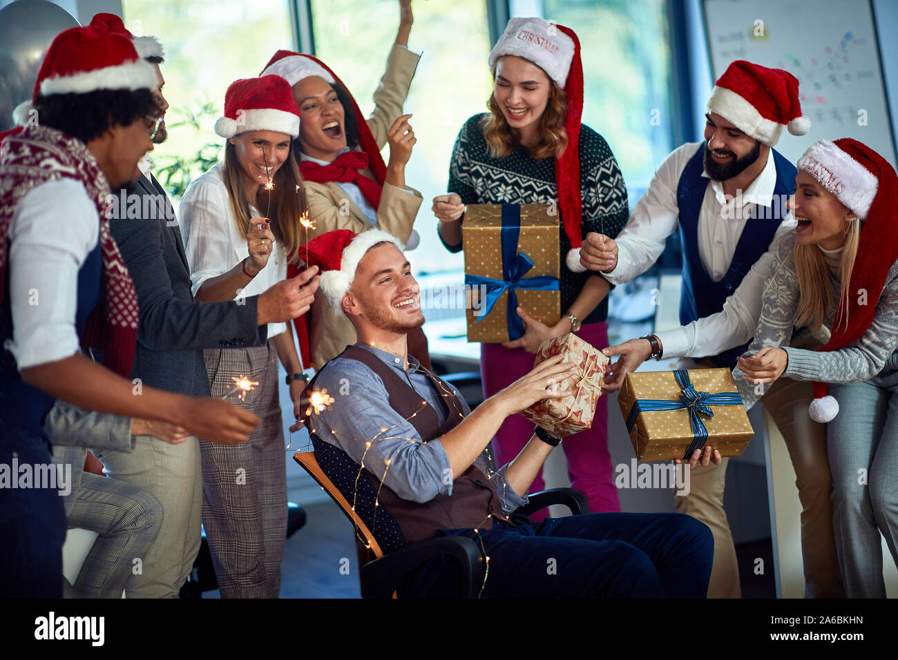 office workers celebrating Christmas together at work.Happy business ...