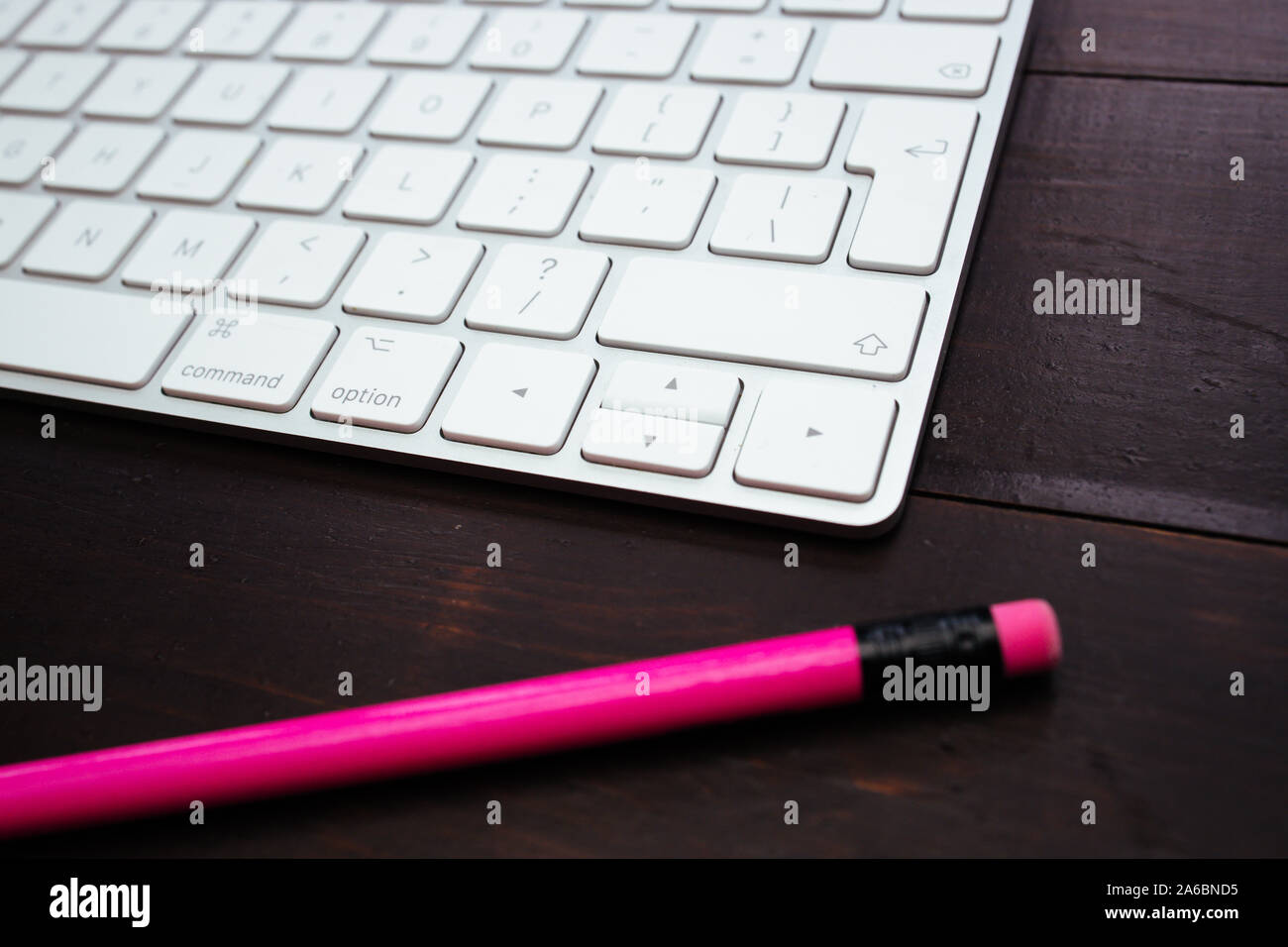 Computer keyboard top view on dark brown wood texture table desk office ...
