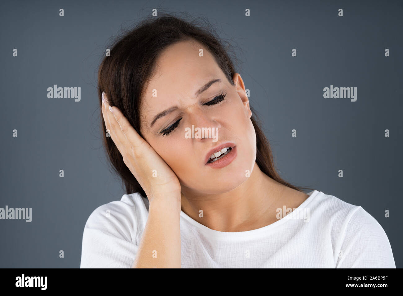 Woman hold ear pain hi-res stock photography and images - Alamy