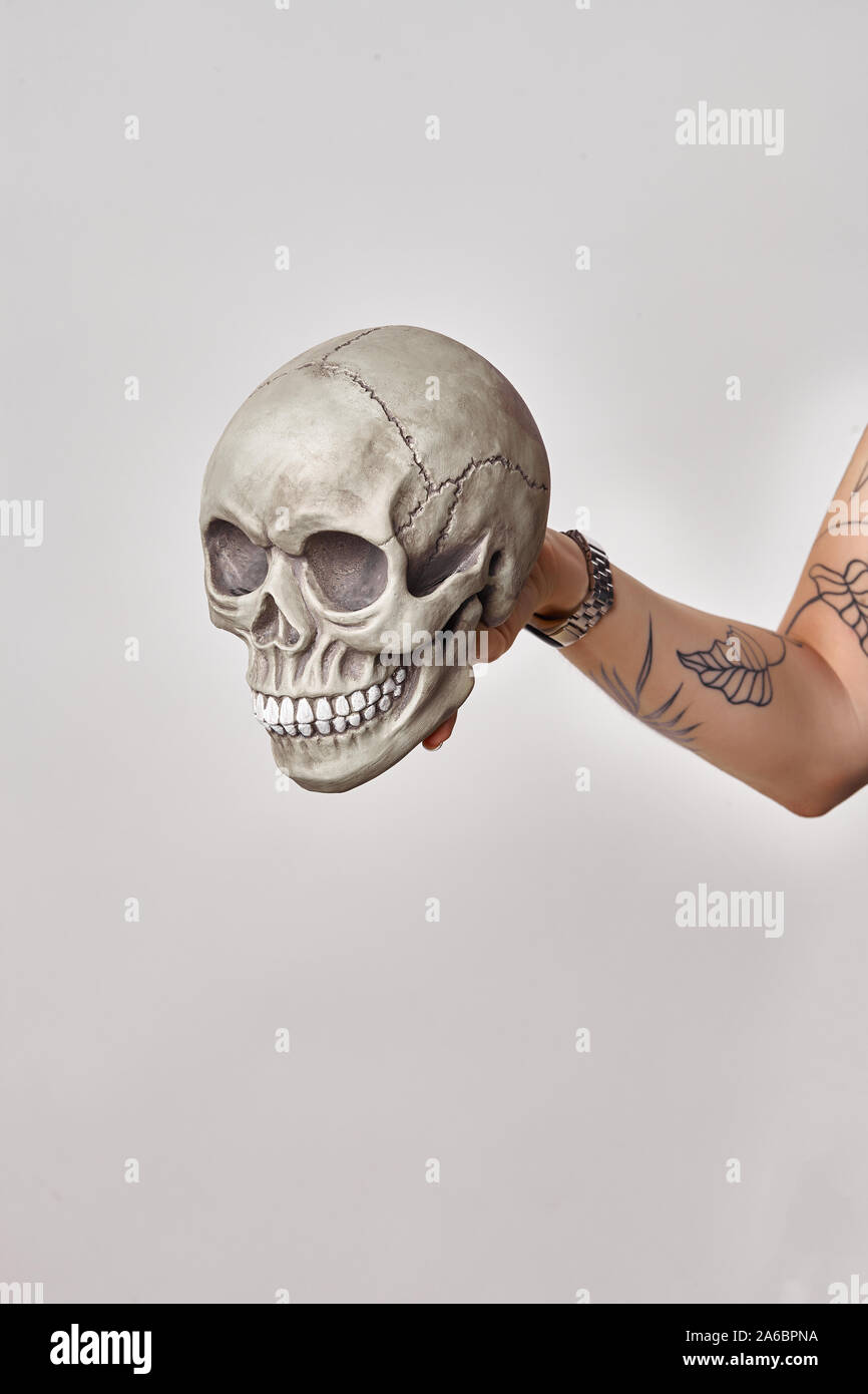 Skeleton Hand Holding A Skull High Resolution Stock Photography and ...
