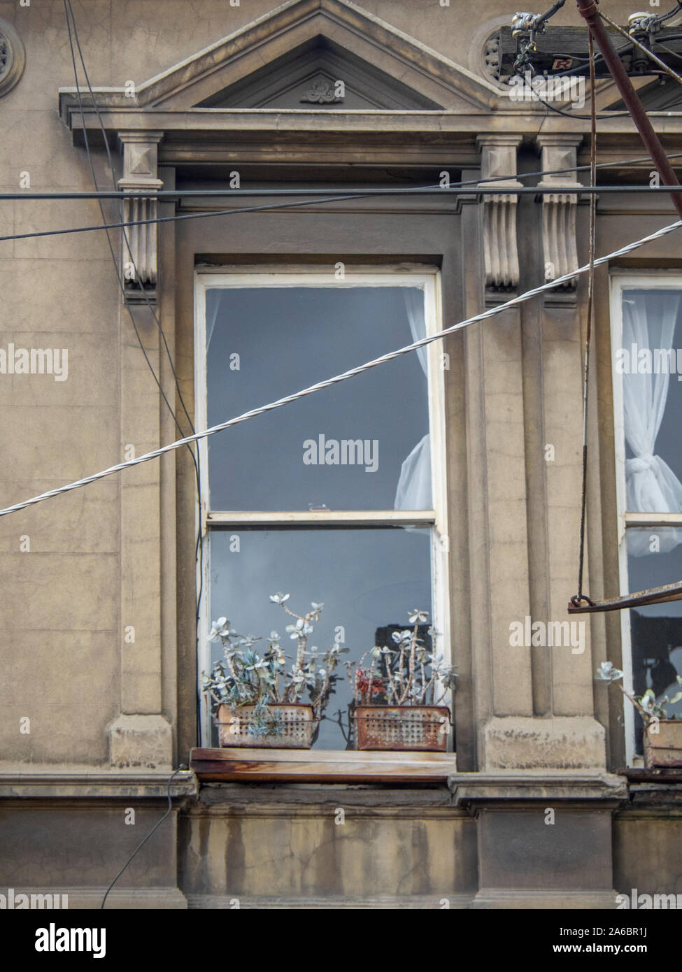 Window with triangular cornice and rusr=tic flower boxes Stock Photo ...