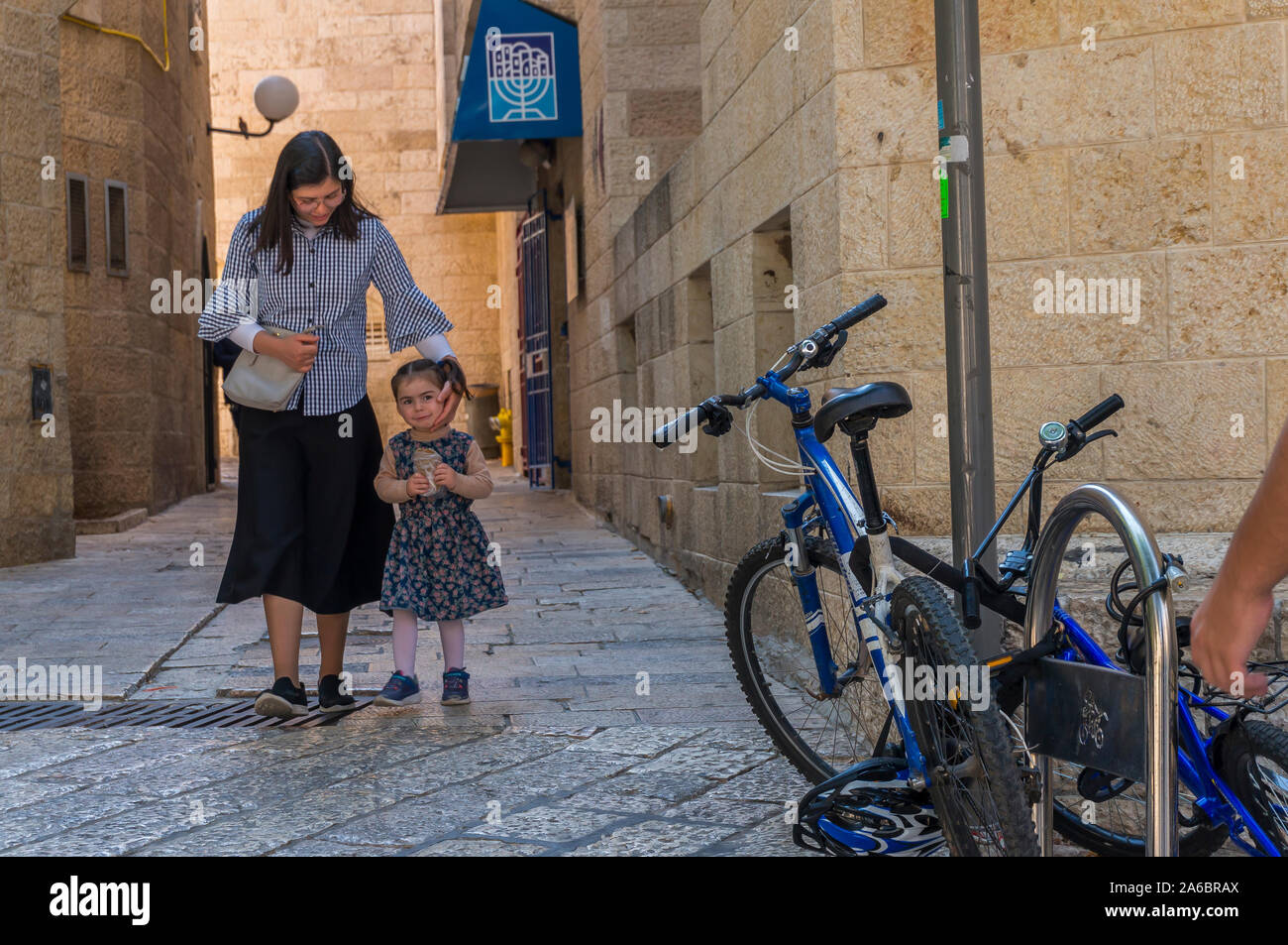 Living in Jerusalem. Everyday life in sacred city of Jerusalem. Mother ...