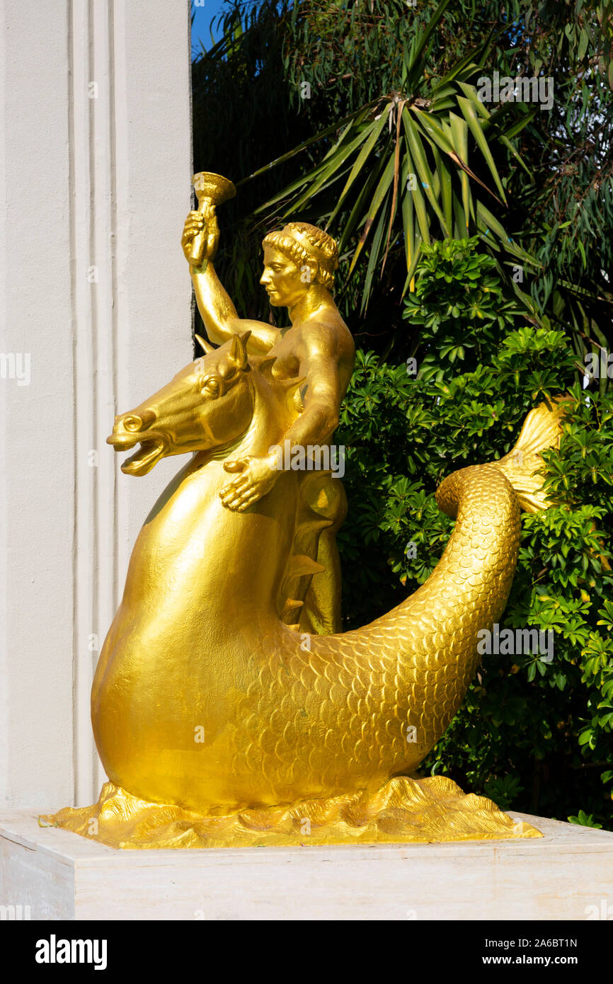 Golden decorative statue in a city park Stock Photo - Alamy